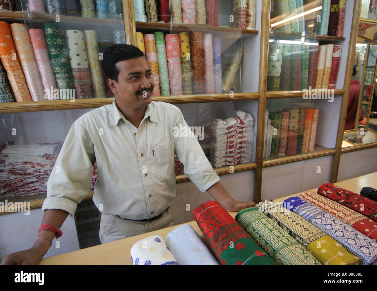 Indian salesman in store hi-res stock photography and images - Alamy