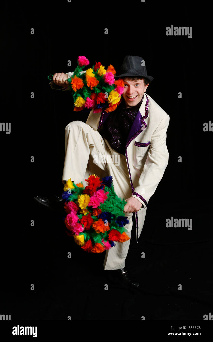 Jezo the magic clown with the gift of flowers Stock Photo - Alamy