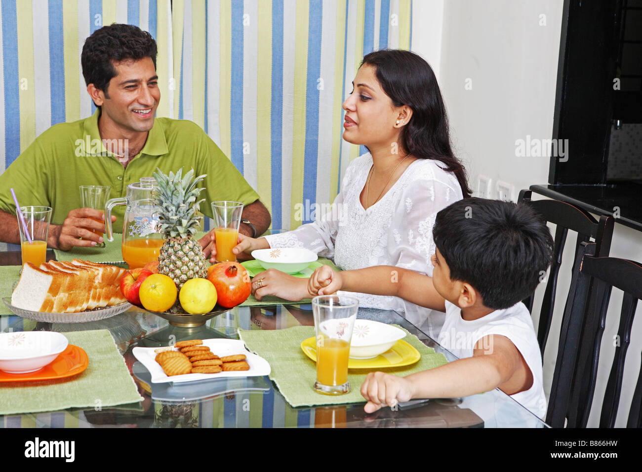 Family at the breakfast table Stock Photo - Alamy
