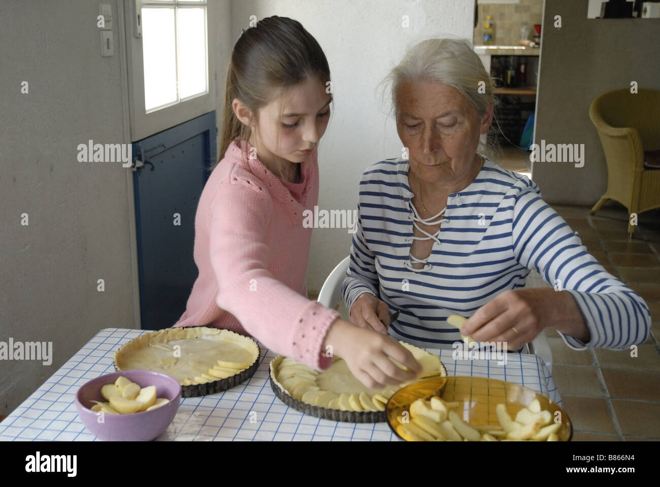 Girl making pastry with her grandmother Stock Photo - Alamy
