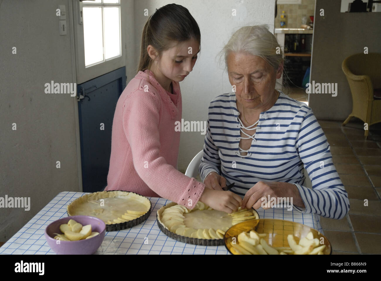 Girl making pastry with her grandmother Stock Photo - Alamy