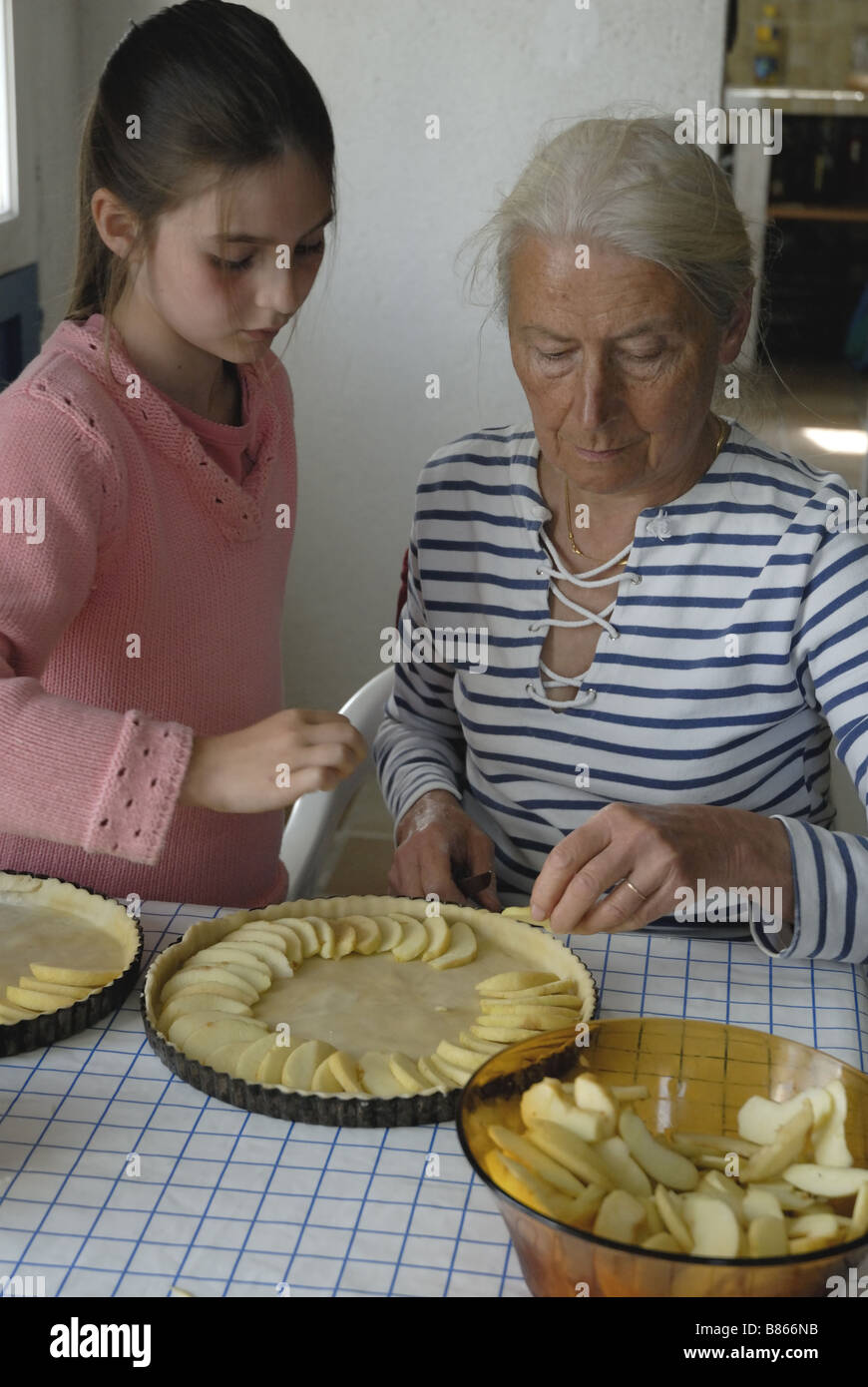 Girl making pastry with her grandmother Stock Photo - Alamy