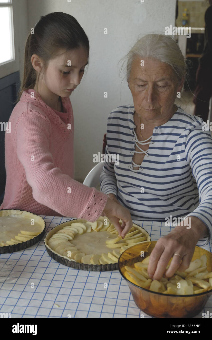 Girl making pastry with her grandmother Stock Photo - Alamy
