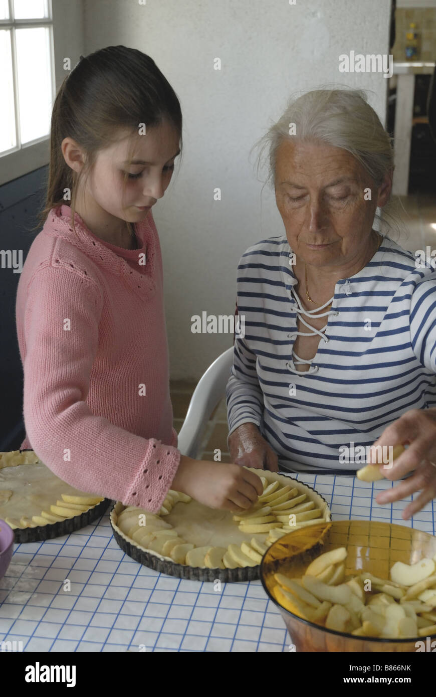 Girl making pastry with her grandmother Stock Photo - Alamy