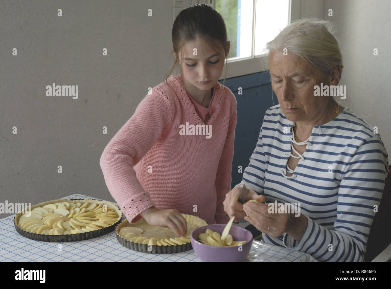Girl making pastry with her grandmother Stock Photo - Alamy