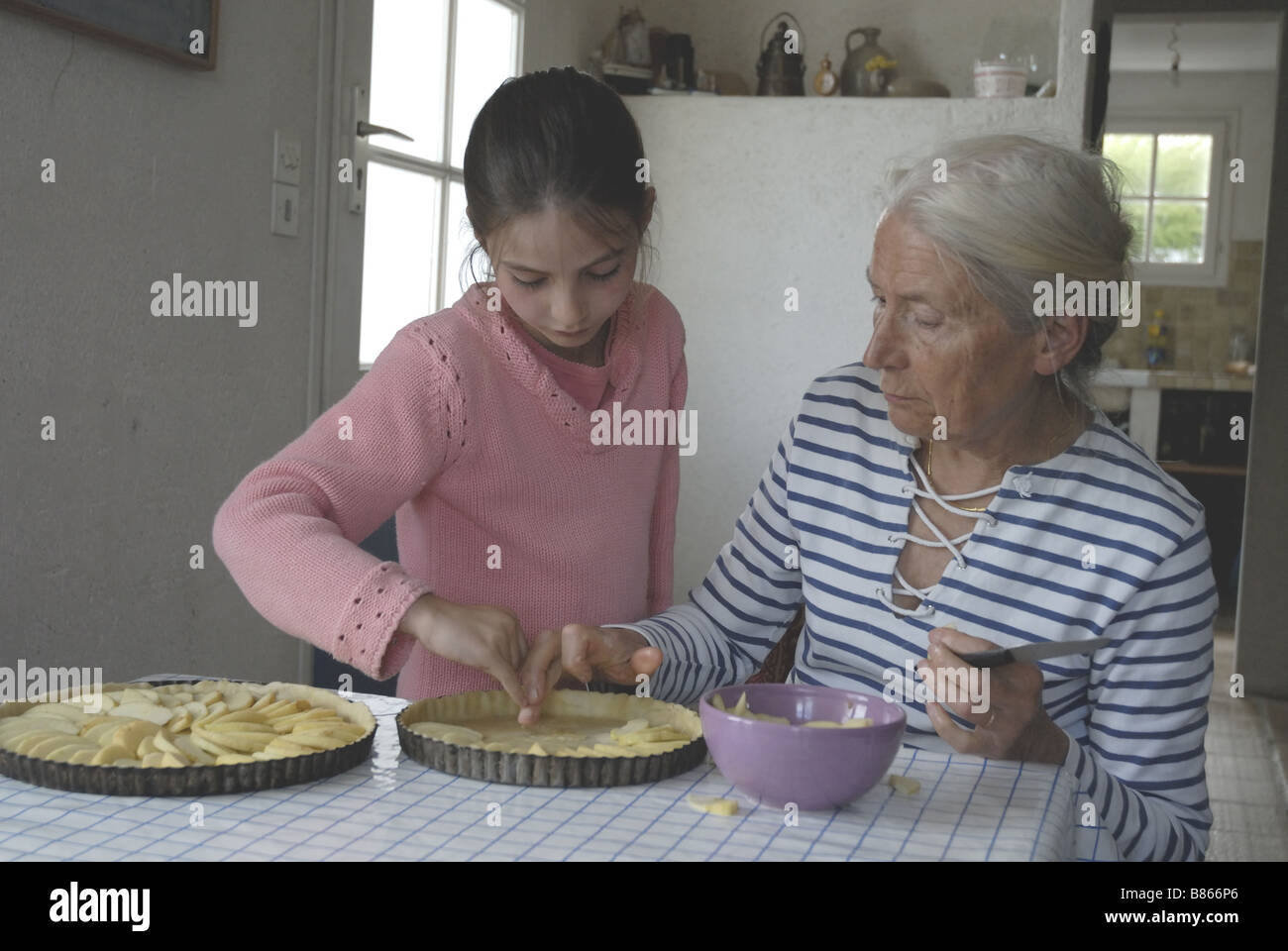Girl making pastry with her grandmother Stock Photo - Alamy