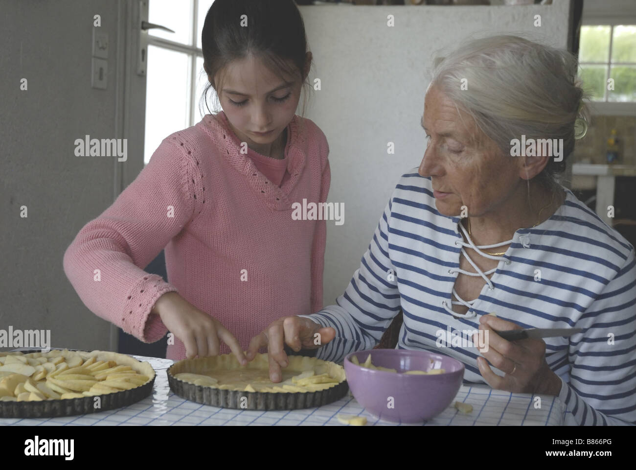 Girl making pastry with her grandmother Stock Photo - Alamy