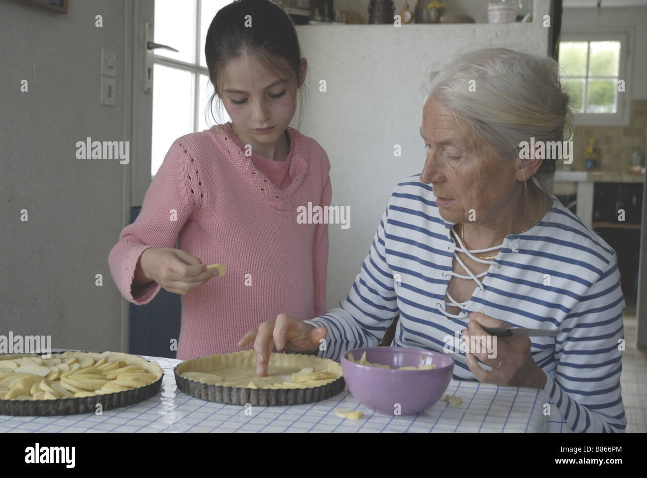 Girl making pastry with her grandmother Stock Photo - Alamy