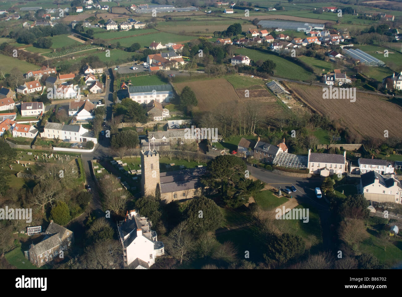 Aerial view of church and village on the Island of Guernsey Stock Photo ...