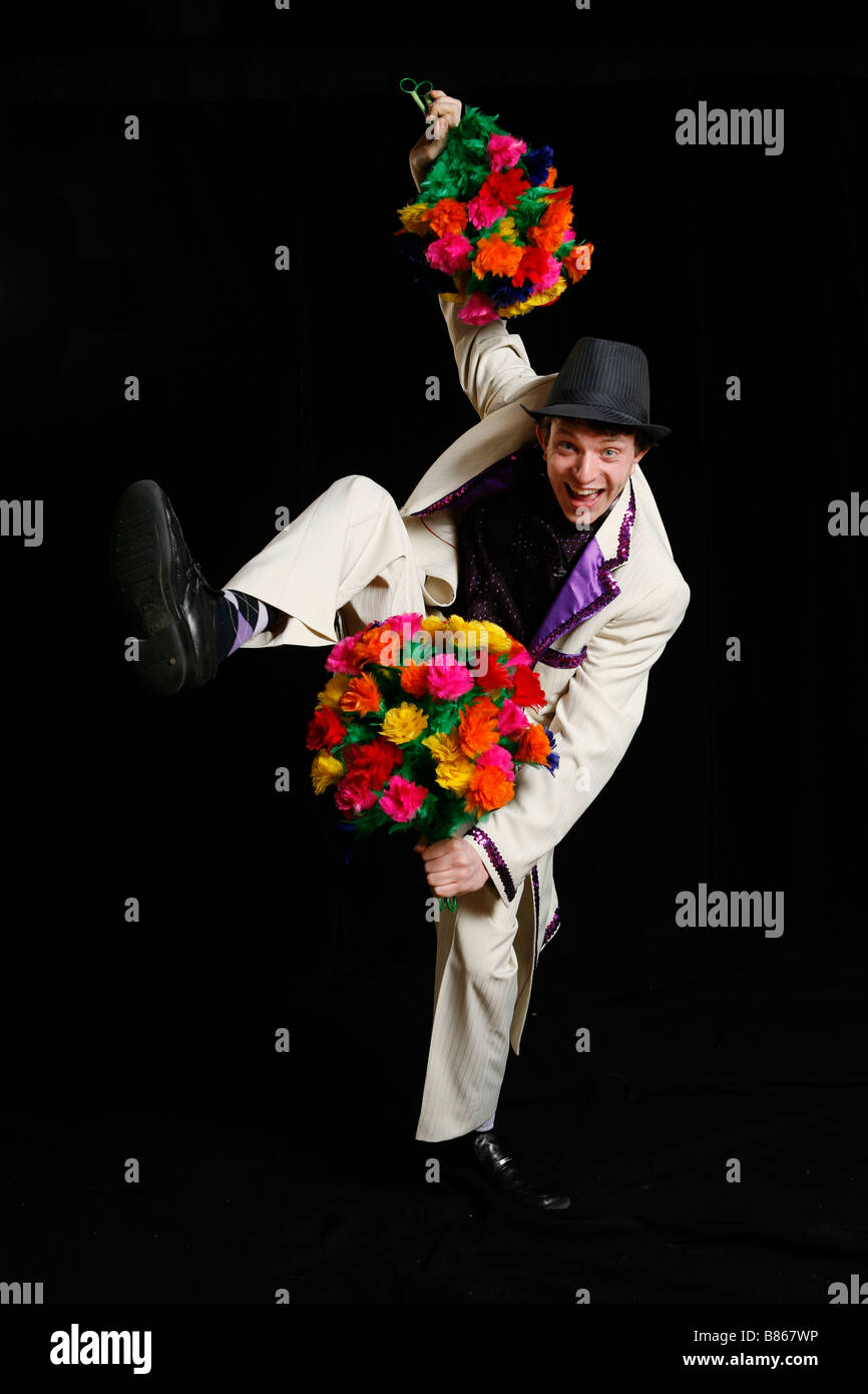 Jezo the magic clown with the gift of flowers Stock Photo - Alamy