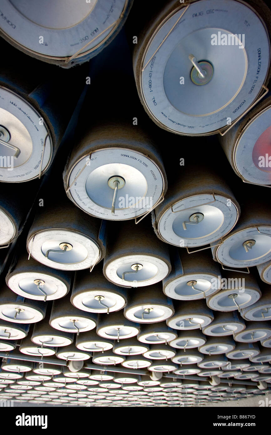 Round air filters form a pattern underneath and air intake system in an ...