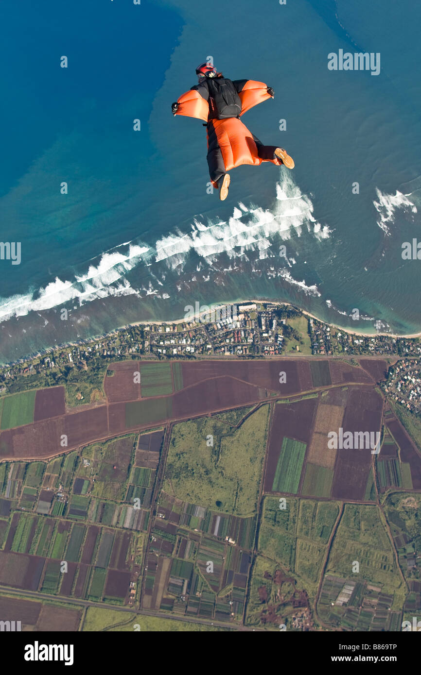 Wingsuit flying over north shore of oahu hi-res stock photography and ...