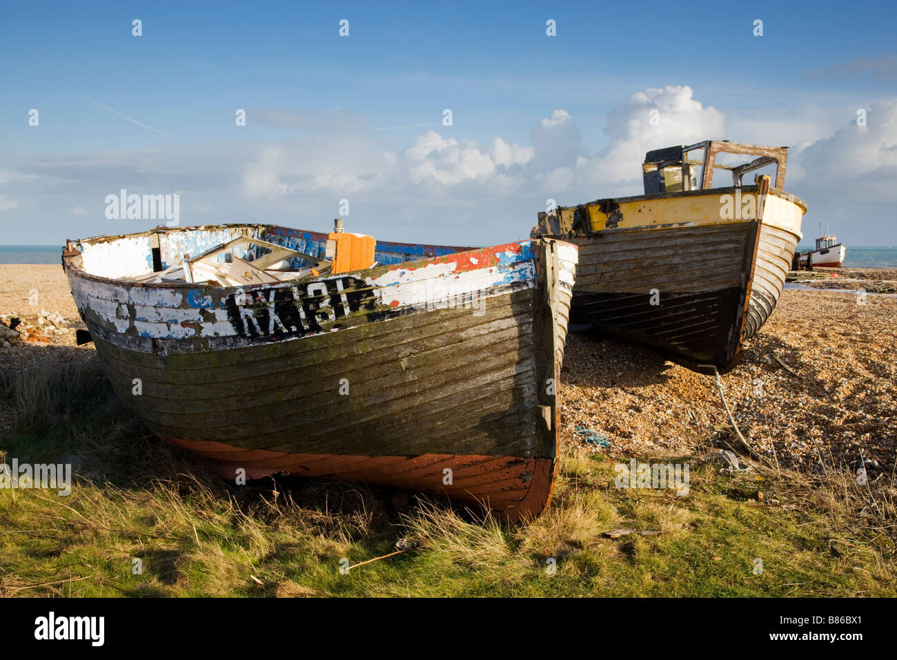 Two abandoned wrecked fishing boats on the Dungeness shingle shore in ...