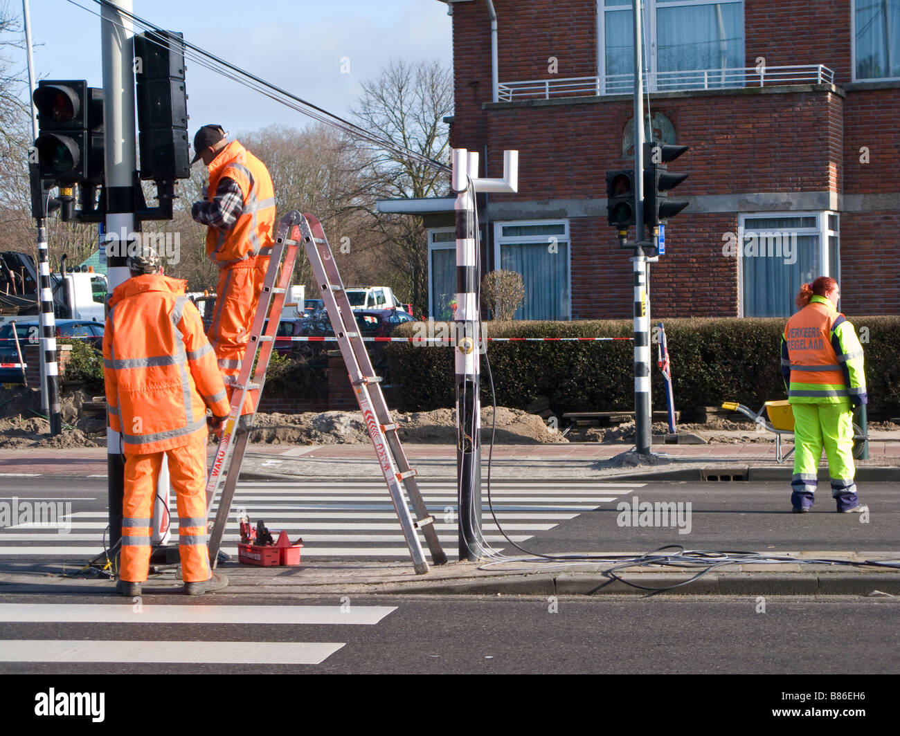 Road construction crew working on traffic lights, The Hague ...