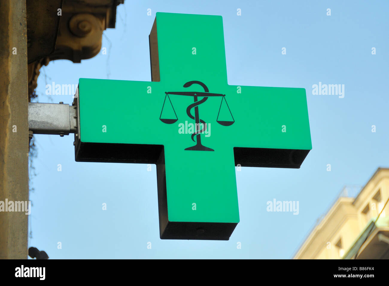 Green pharmacy sign attached on a wall outside the store Stock Photo ...