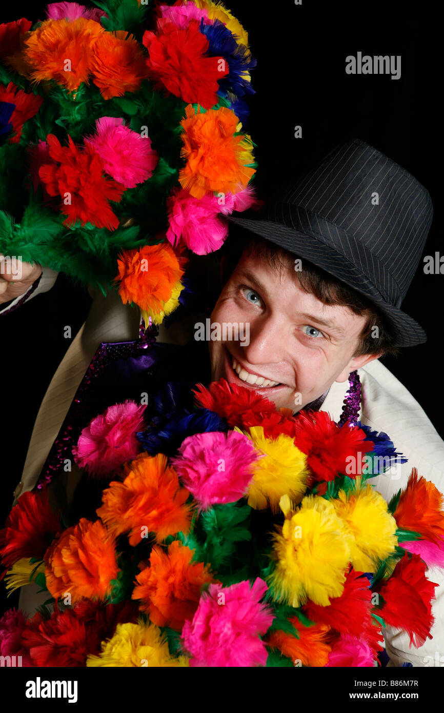 Jezo the magic clown with the gift of flowers Stock Photo - Alamy