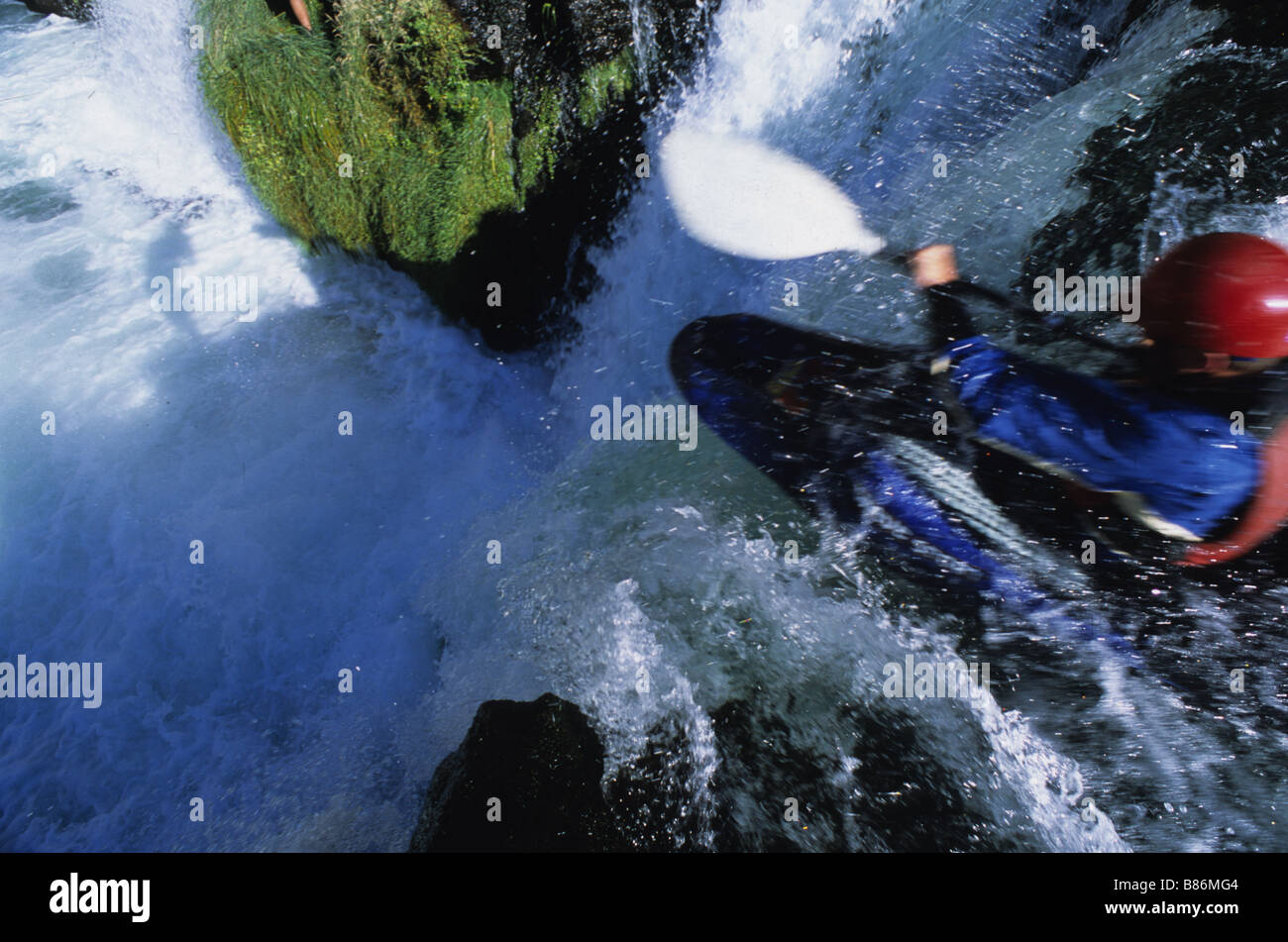 A kayaker drops Steelhead Falls on the Deschutes River Stock Photo - Alamy