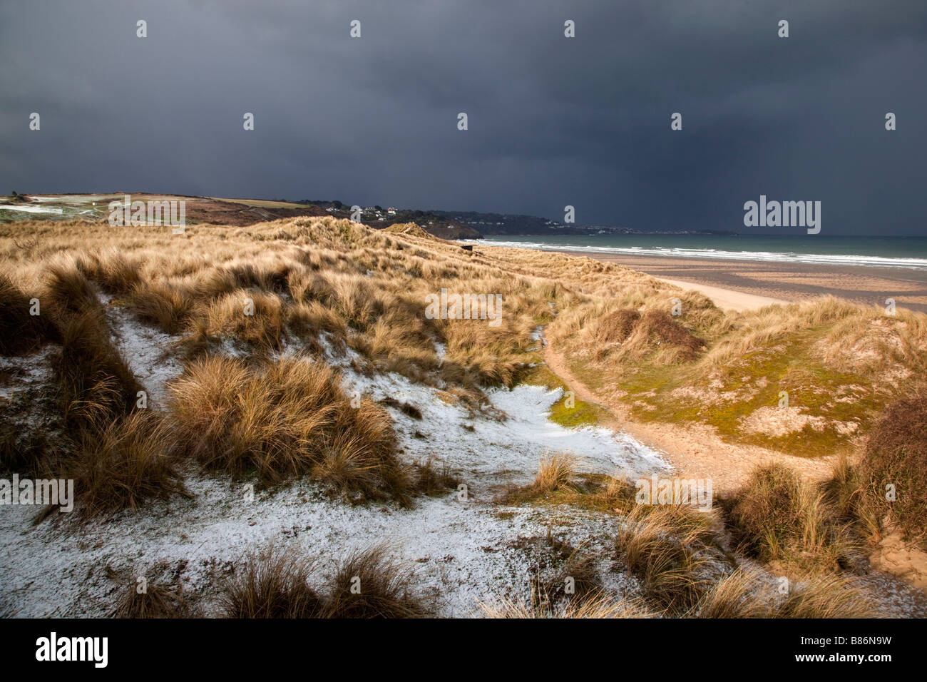 snow on the dunes porth kidney beach lelant cornwall Stock Photo - Alamy