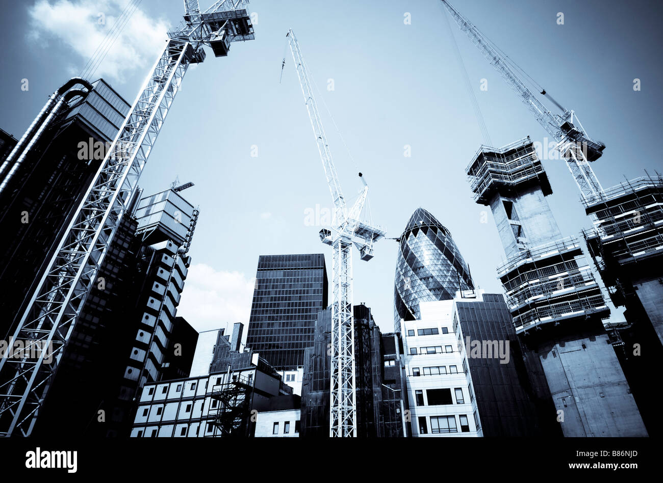 The Gherkin along side a building under construction Stock Photo - Alamy