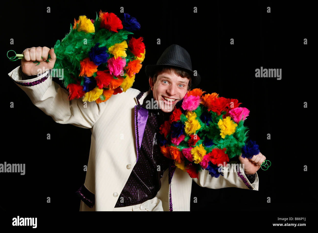 Jezo the magic clown with the gift of flowers Stock Photo - Alamy