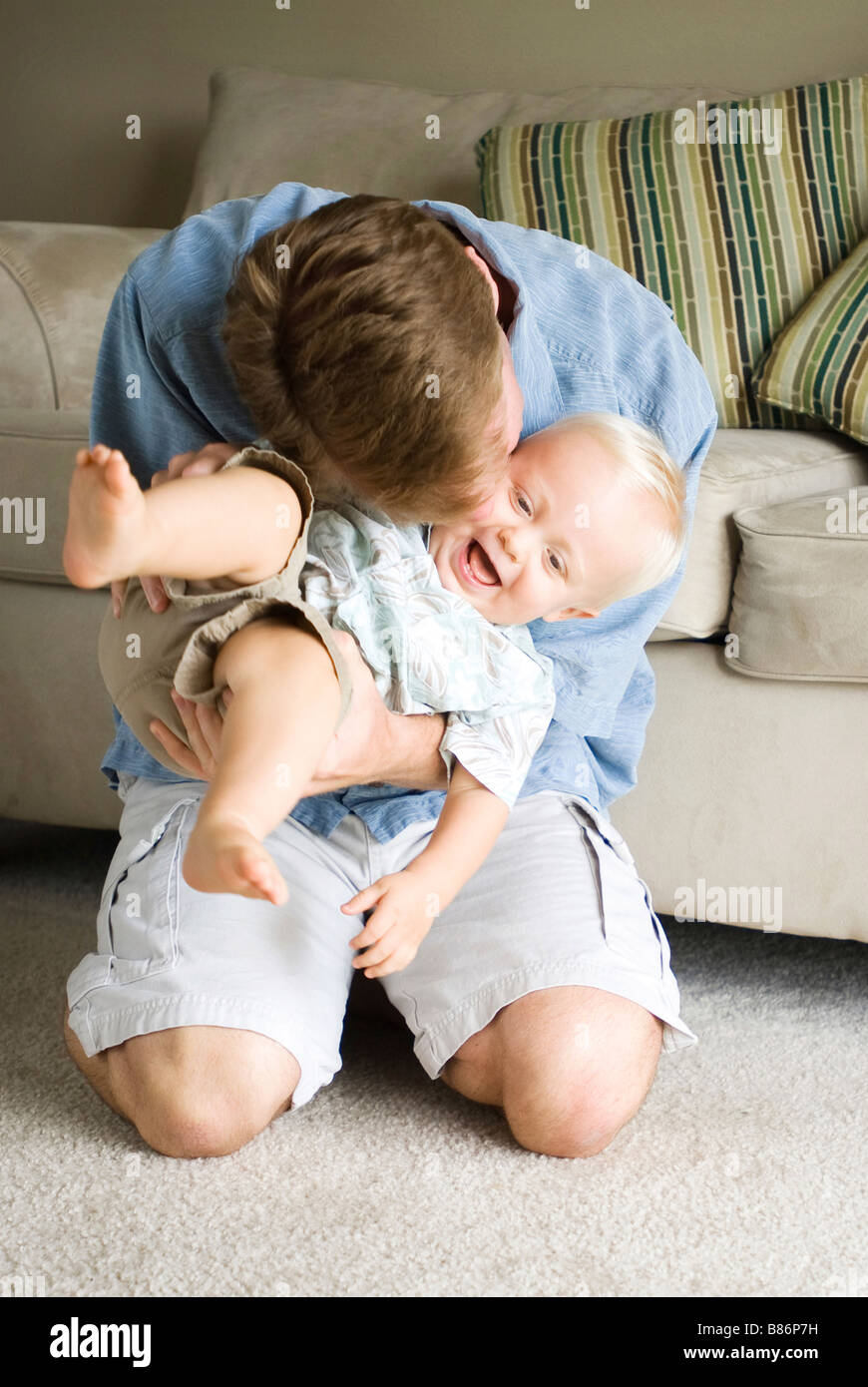 father playing with infant son Stock Photo - Alamy