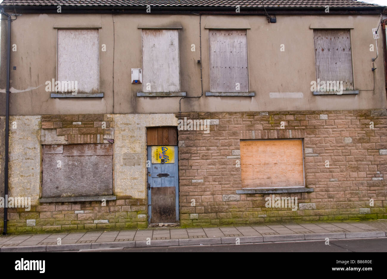 Uk house with boarded up doors and windows hi-res stock photography and ...