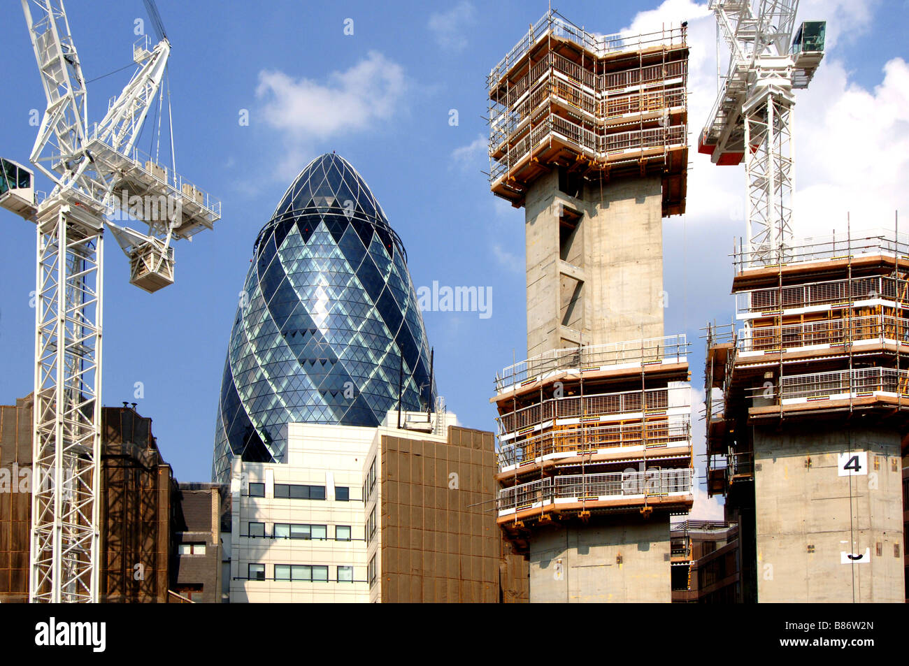 The Gherkin along side a building under construction Stock Photo - Alamy