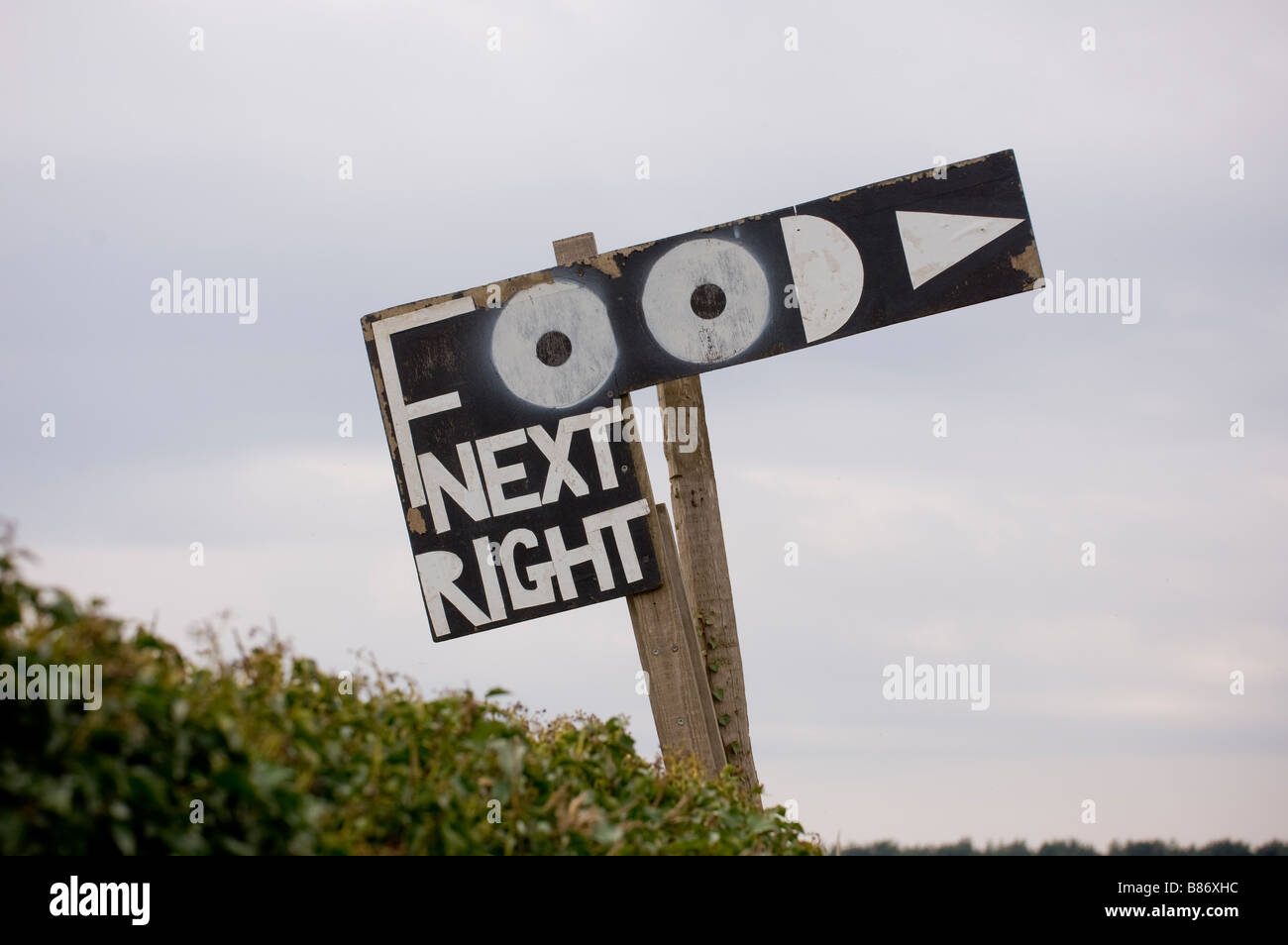 Food Next Right sign in hedge Stock Photo - Alamy