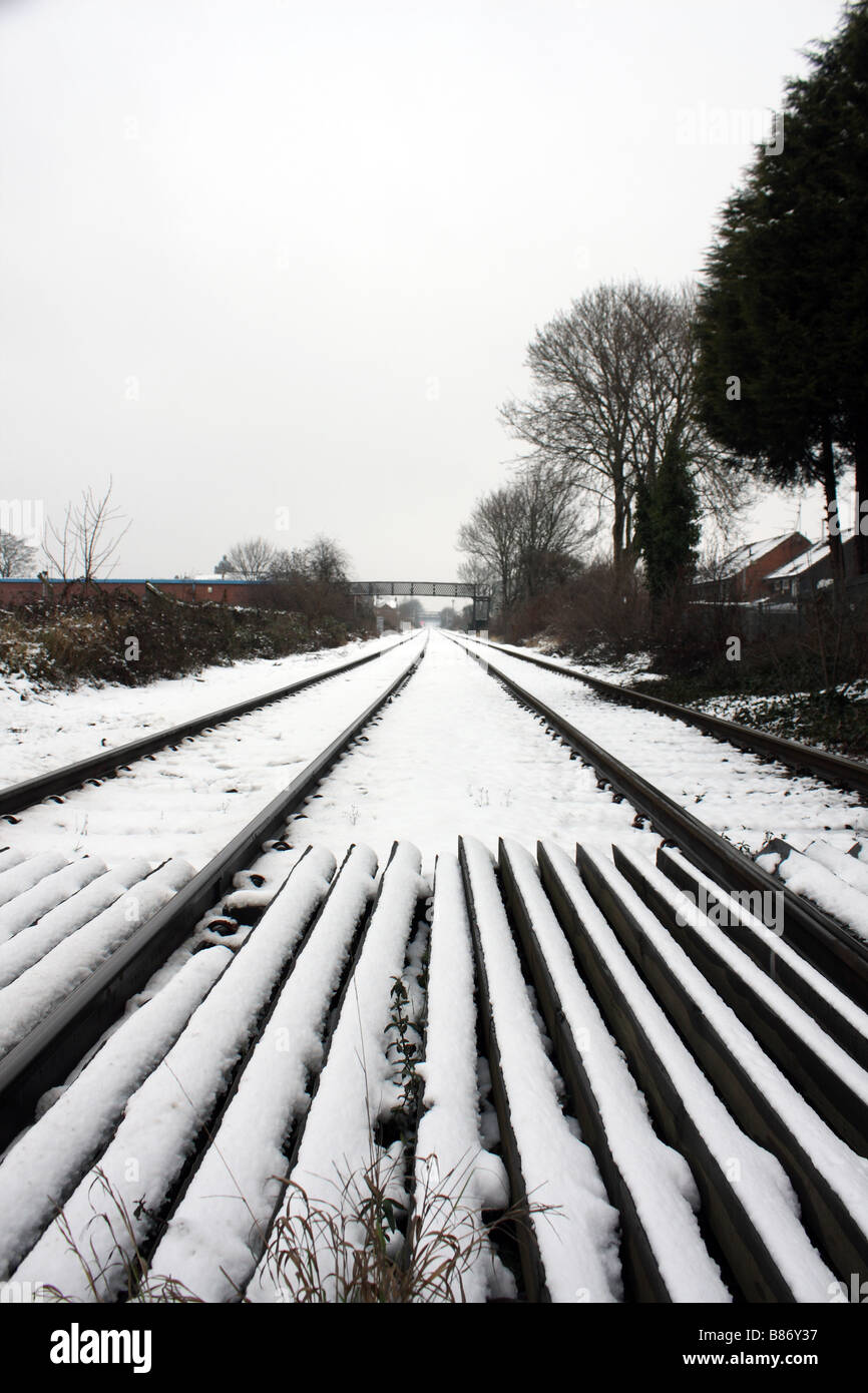 A railway train line in the snow Stock Photo - Alamy