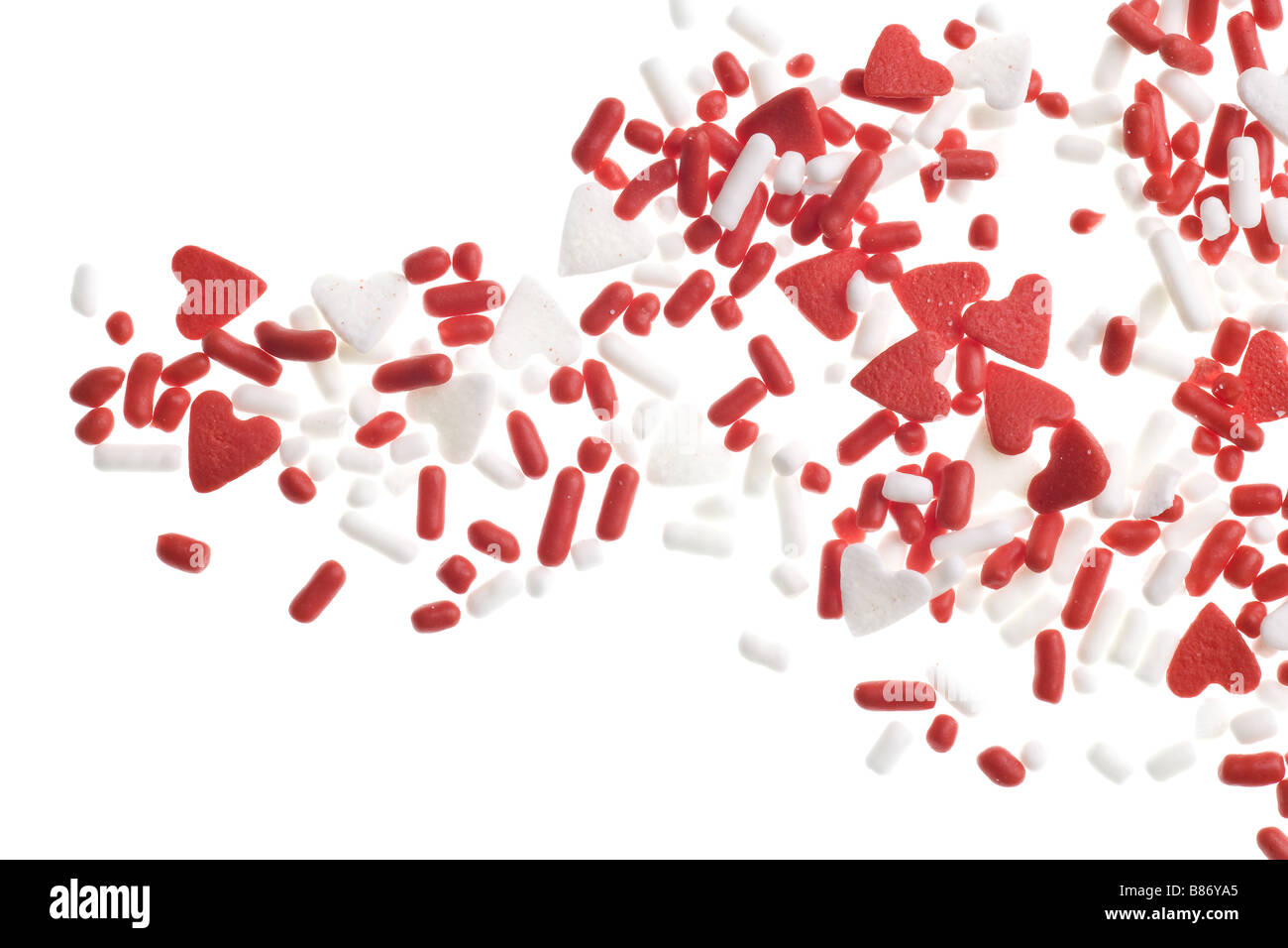 Valentine heart sprinkles isolated on white background Stock Photo - Alamy