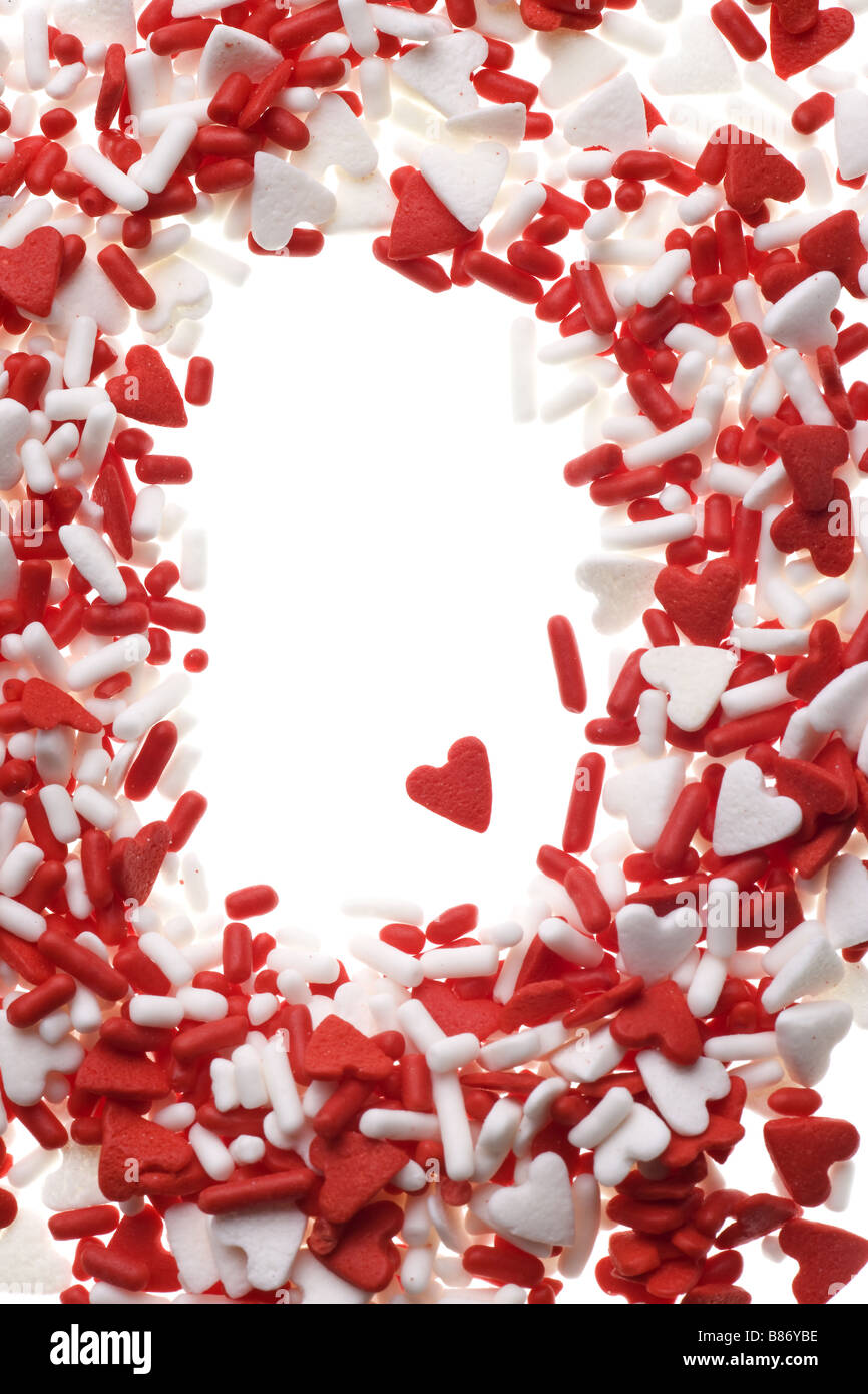 Valentine heart sprinkles isolated on white background Stock Photo - Alamy