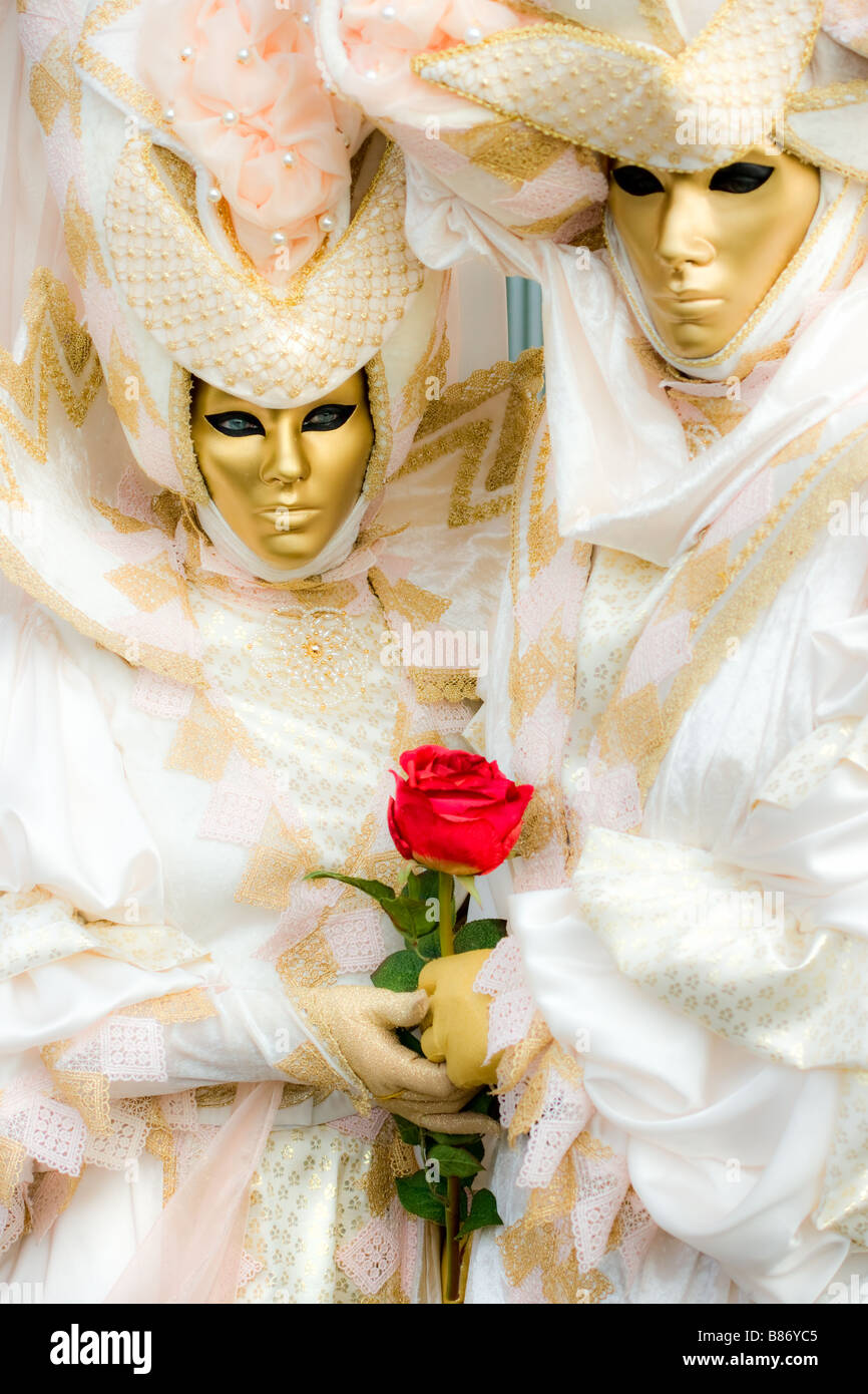 Portrait of two Beautiful golden masks in Venice Italy Stock Photo - Alamy