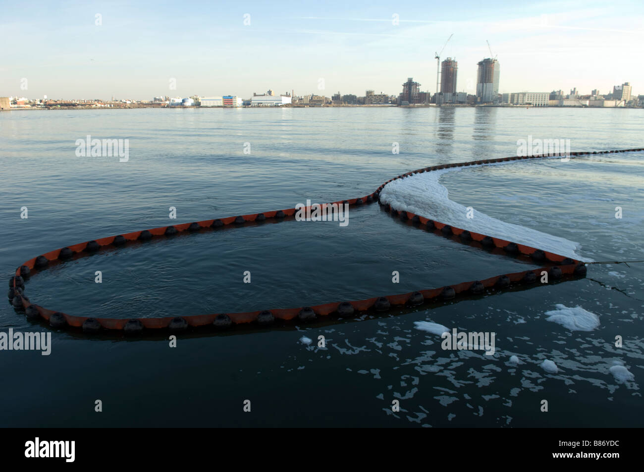 A boom to contain material from flowing into the East River in New York ...