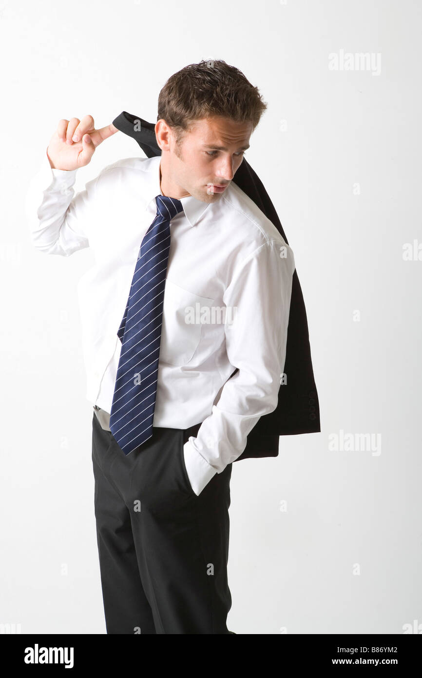 Businessman holding jacket on back side view looking away Stock Photo ...
