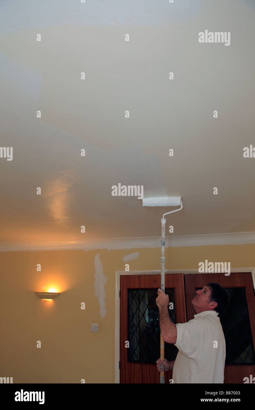 united kingdom a decorator at work in a private house Stock Photo - Alamy