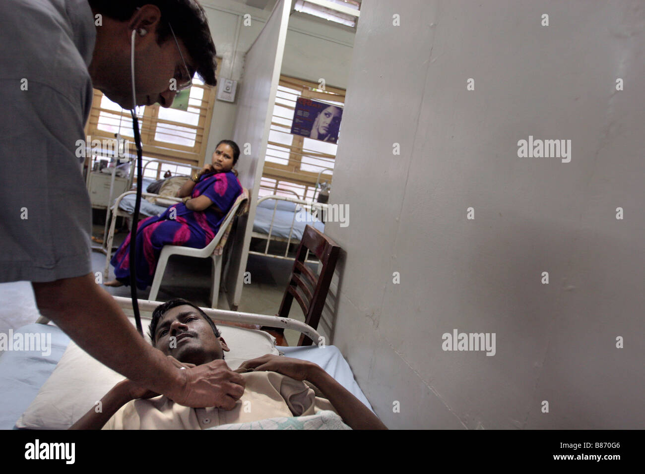 An Indian doctor looks after patients affected by hiv and aids in a ...
