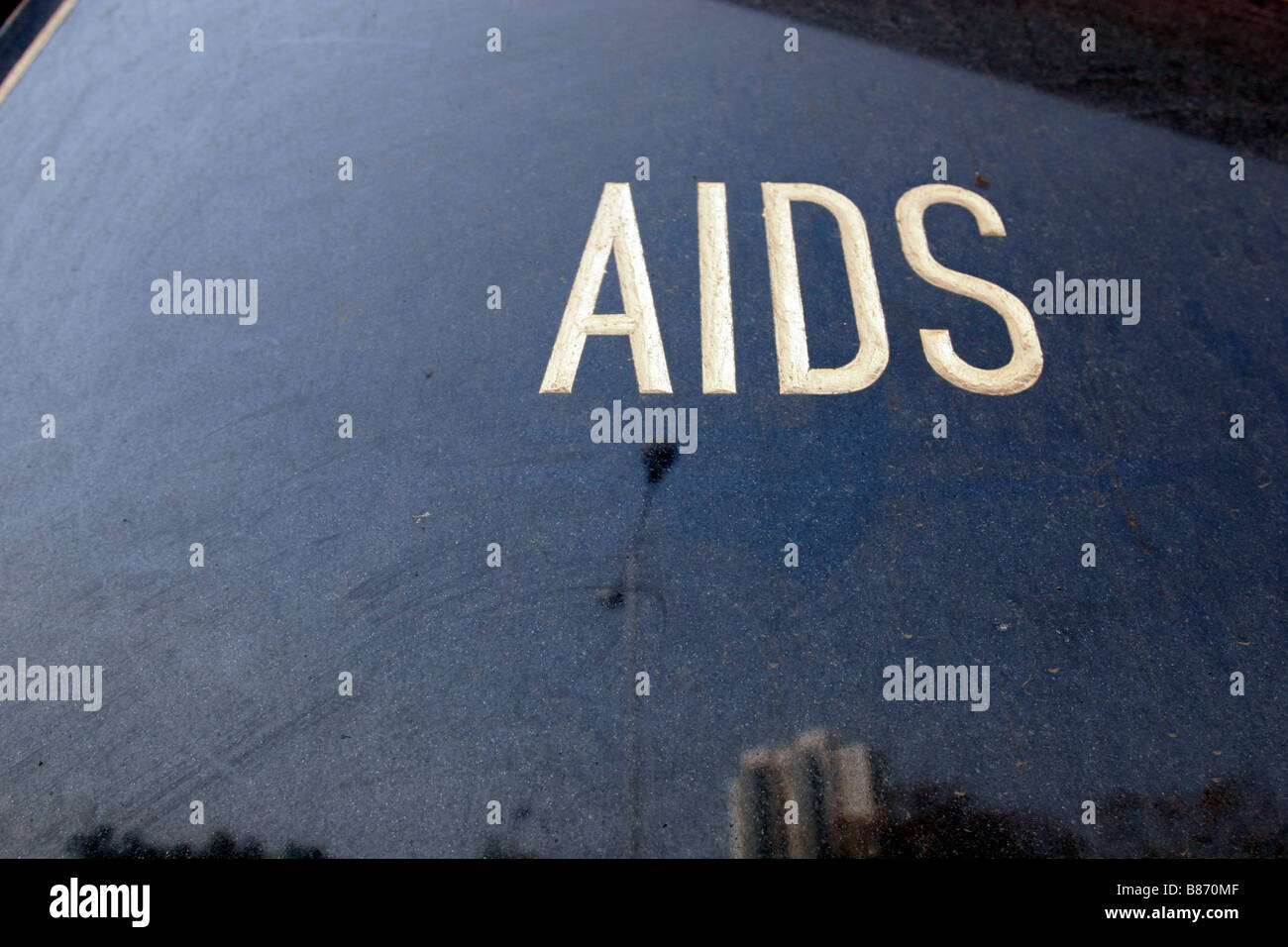 The Word Aids Written On A Wall At The Entrance To An Ngo Working