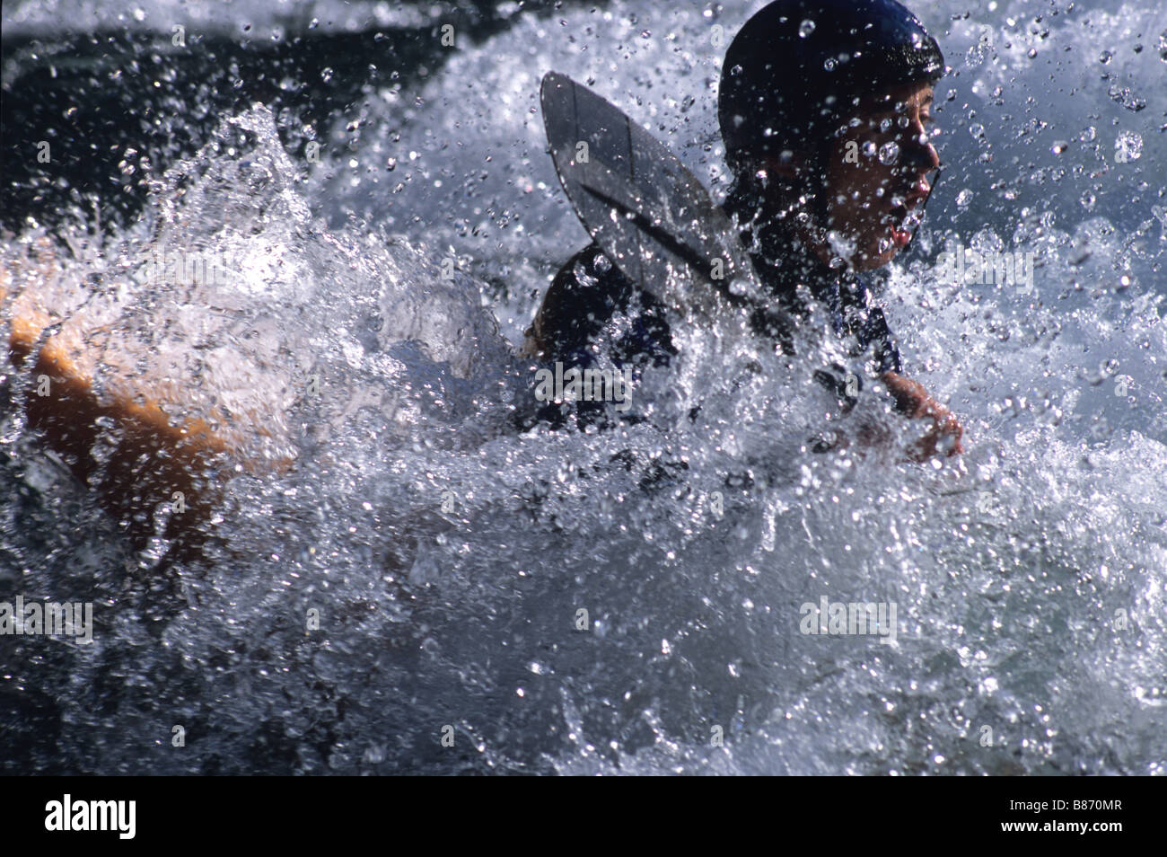 A kayker takes a deep breath before entering a wave on the Deshutes ...