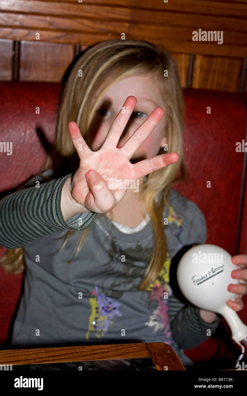 Young girl counting age on fingers Stock Photo - Alamy