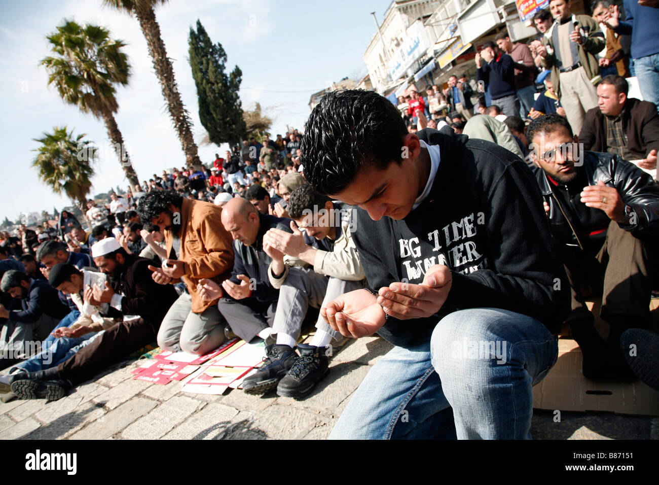 Palestinian Muslims praying outside the Damascus Gate of the Old City ...