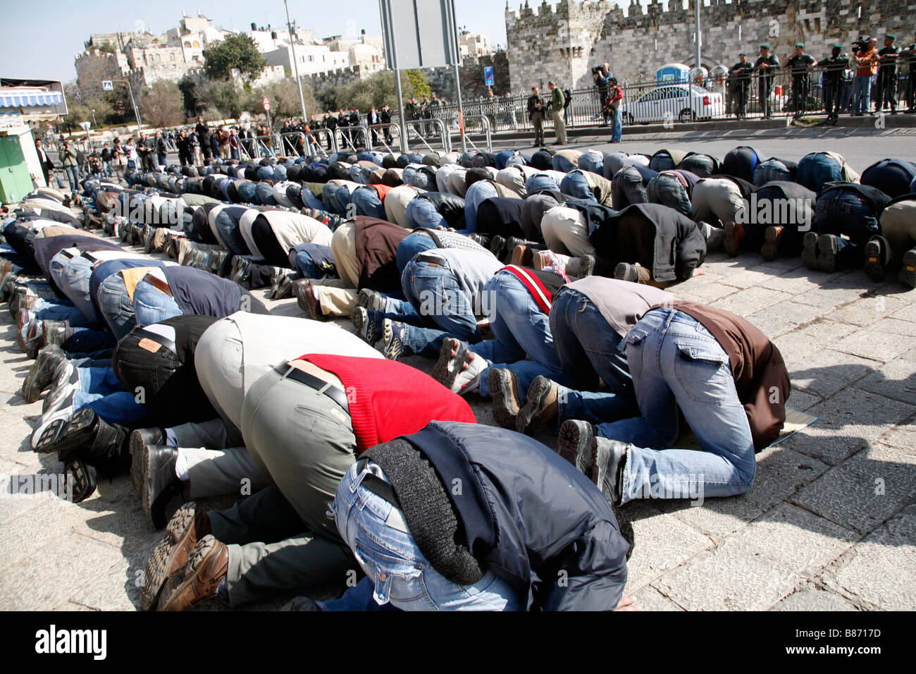 Palestinian Muslims praying outside the Damascus Gate of the Old City ...