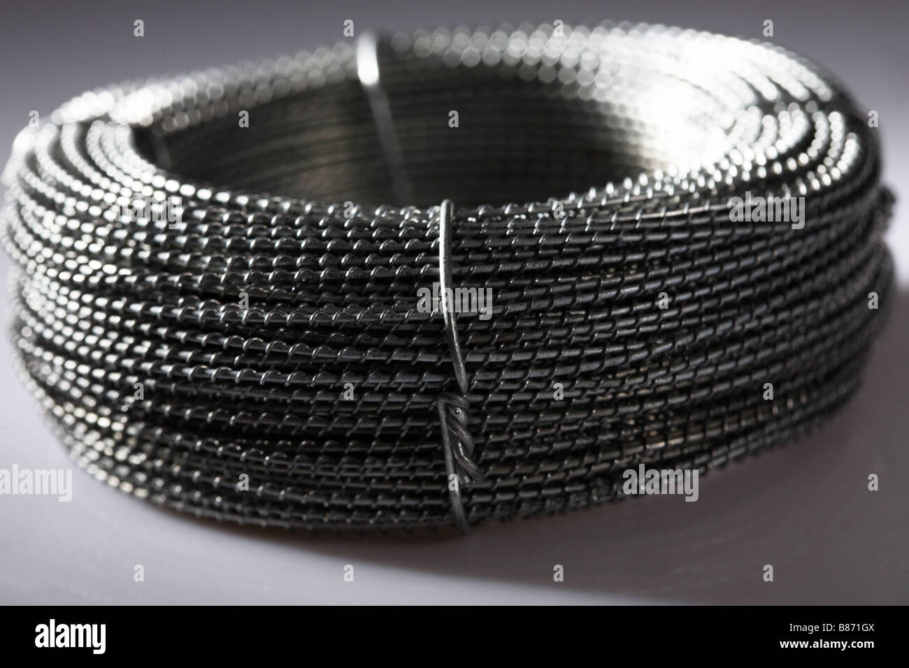 Close up of rolled fencing wires Stock Photo - Alamy