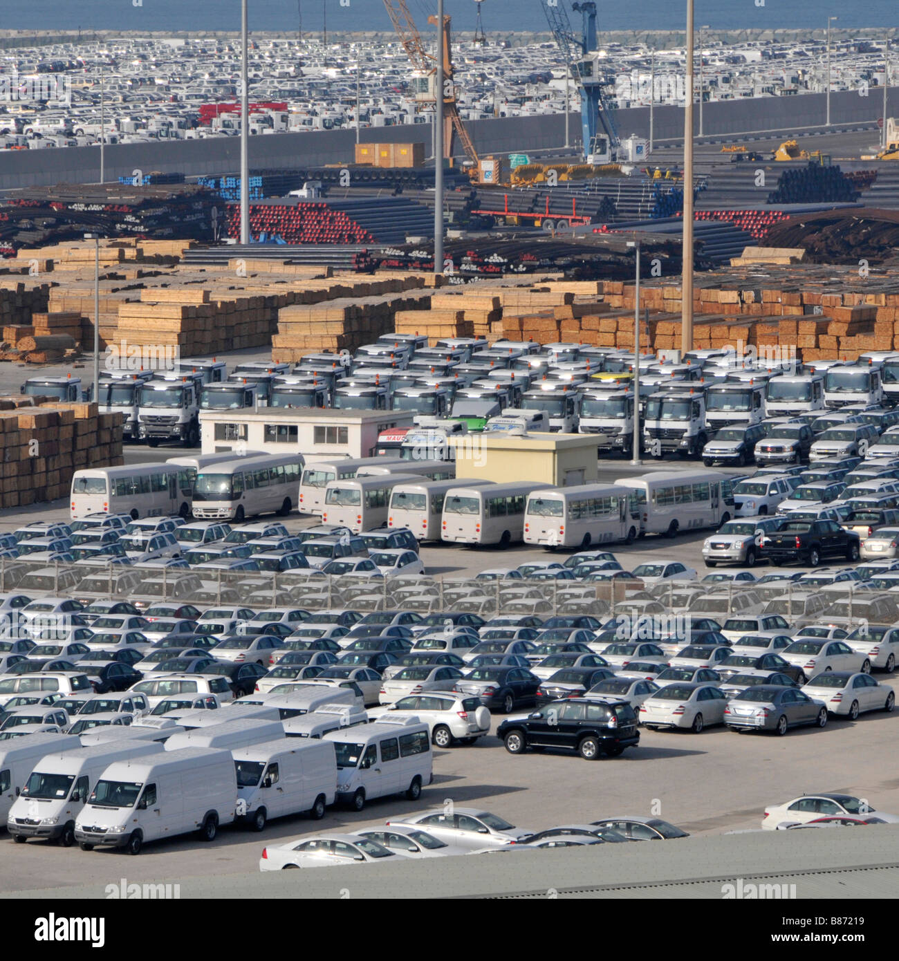 Aerial view of dockside commercial port storage rows of imported new ...