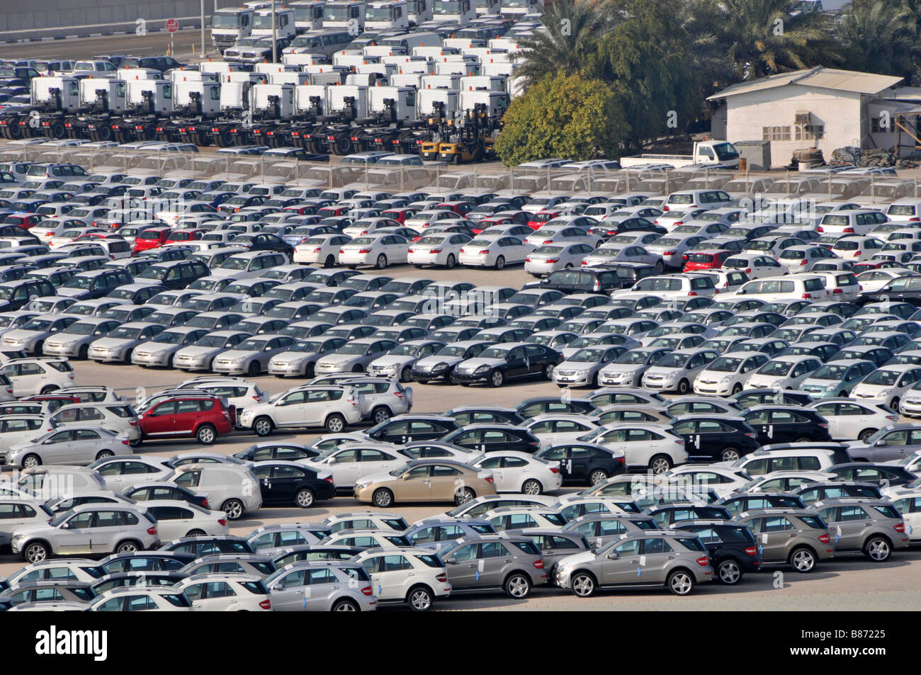 Aerial view of dockside commercial port storage rows of imported new ...