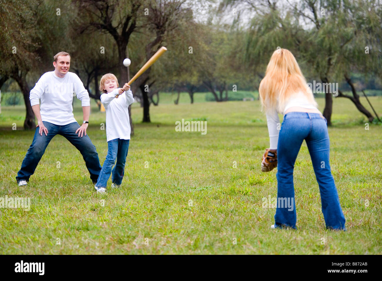 Family playing baseball Stock Photo - Alamy