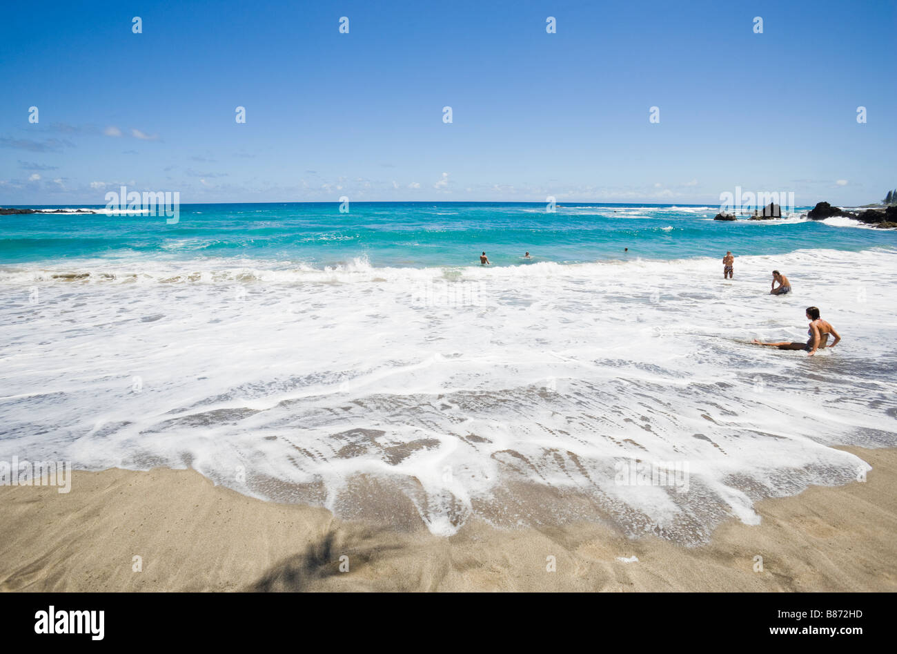 Tourists enjoying the surf at Hamoa Beach Maui Hawaii Stock Photo - Alamy