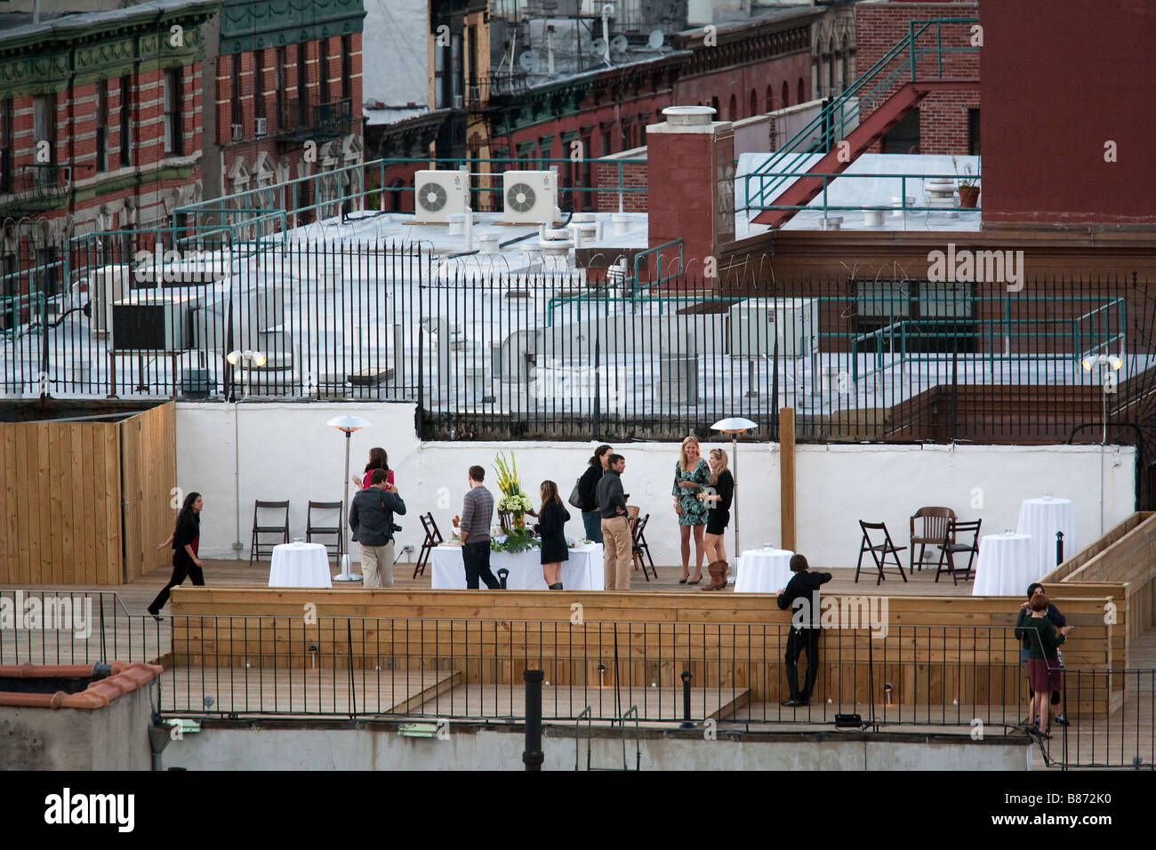 Party on building roof The Bowery Manhattan New York NY Stock Photo - Alamy