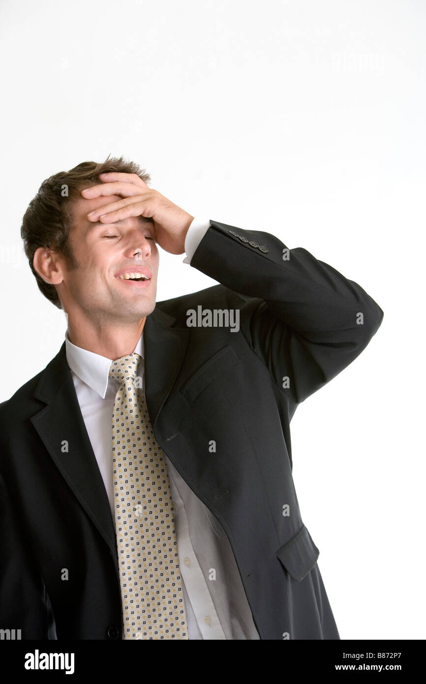 Businessman with hand on forehead Stock Photo - Alamy