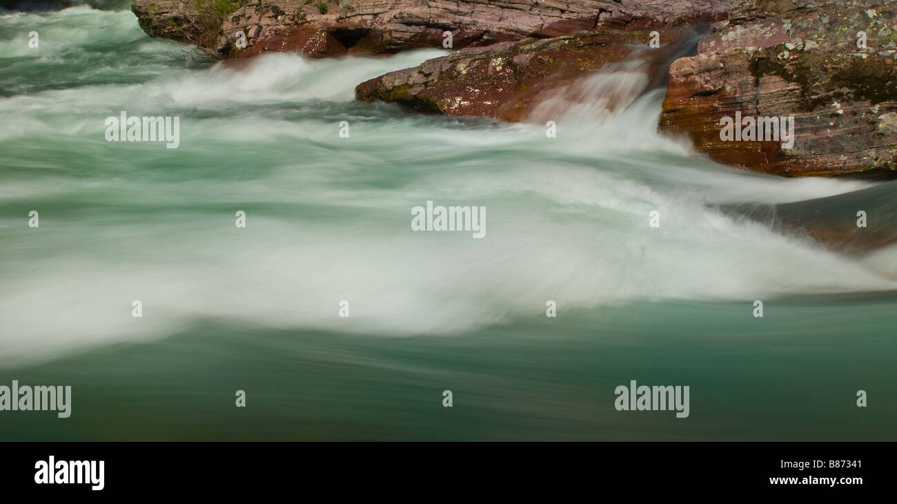 Beautiful image of water flowing off a boulder in a river Stock Photo ...