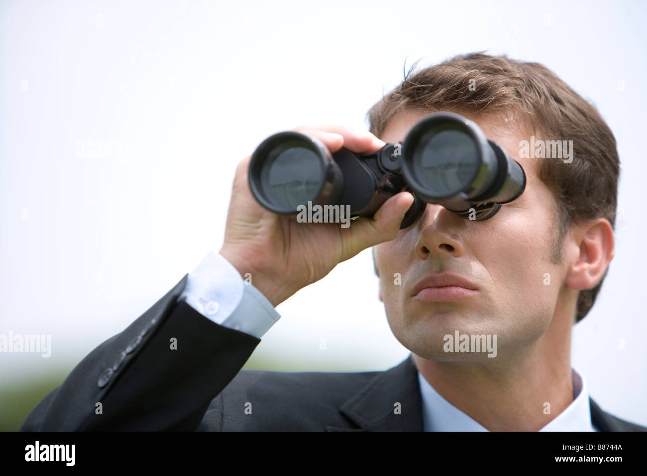 Businessman using binoculars hi-res stock photography and images - Alamy